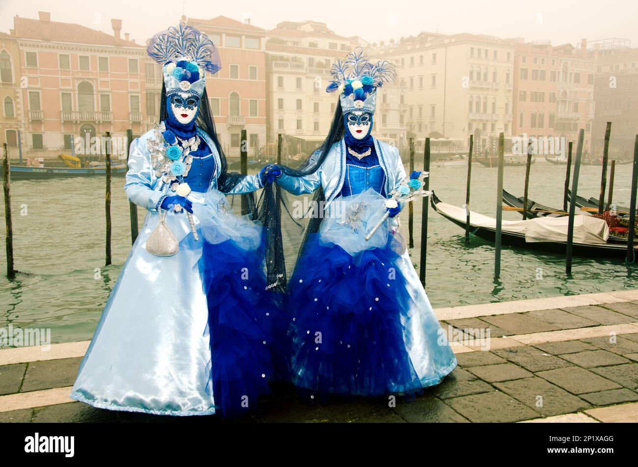 Couple of Venice Carnival masks in color blue with gondolas and ...