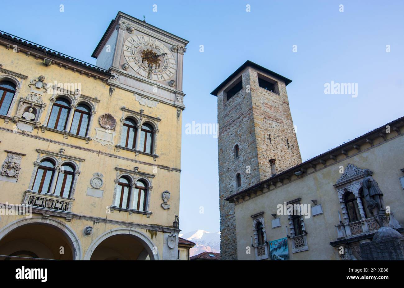 the clock tower and the town hall in Piazza del Duomo in Belluno Stock ...