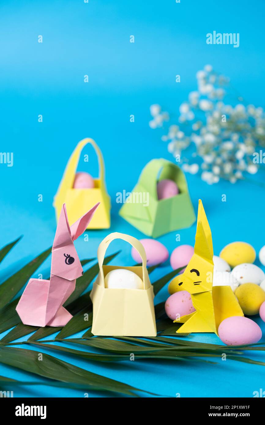 Two figures of Easter bunnies made of paper, origami crafts and a ...