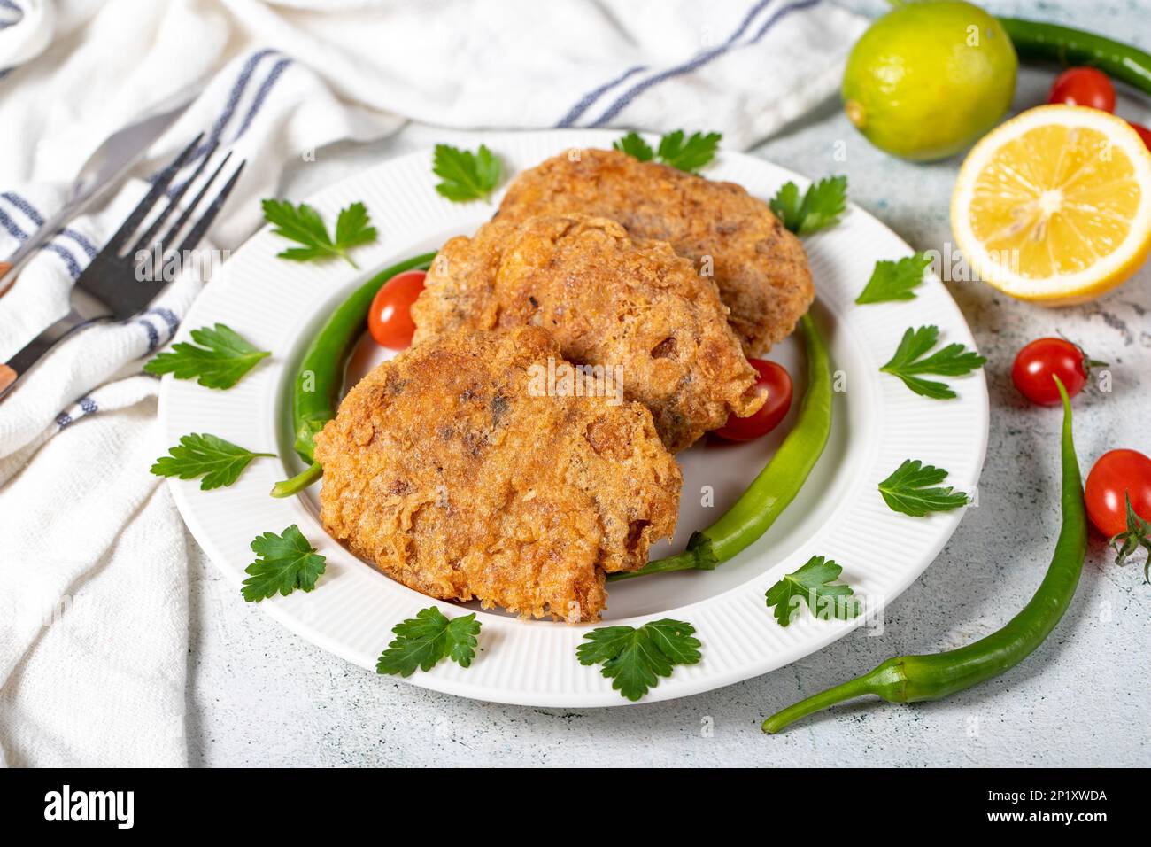 Frying rice and minced meatballs on the gray floor. Turkish women ...