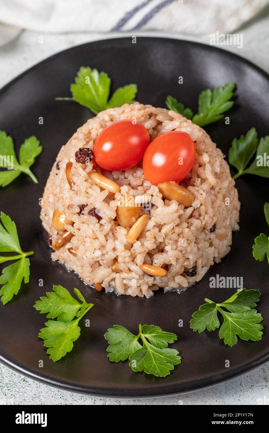 Rice rice with pine pistachios and almonds on a gray floor. Bademli ic ...