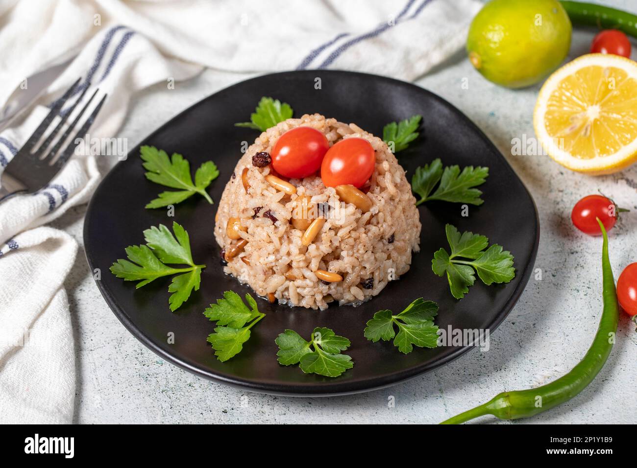 Rice rice with pine pistachios and almonds on a gray floor. Bademli ic ...