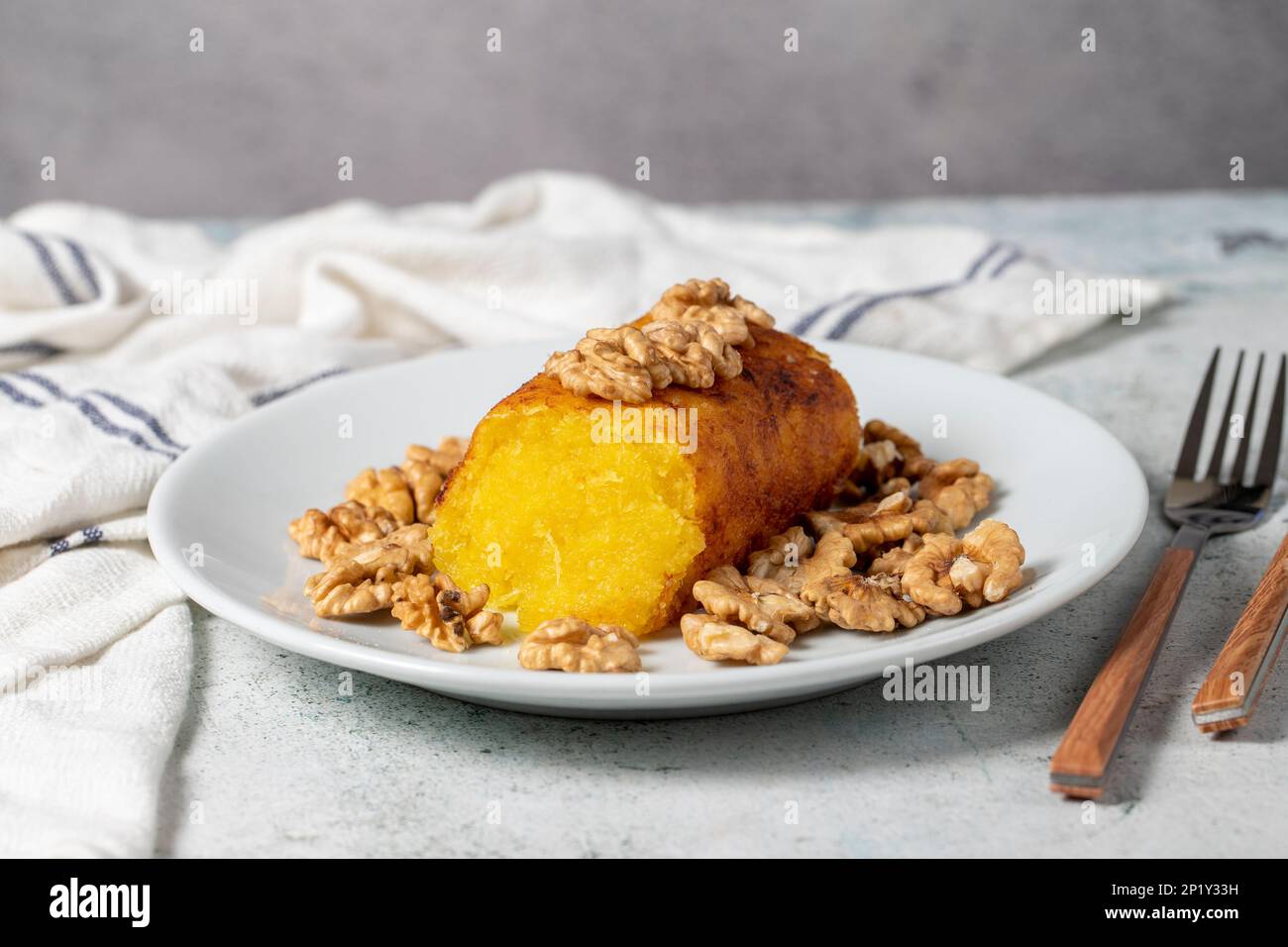 Cheese halva on gray floor. Traditional Mediterranean cuisine flavors ...