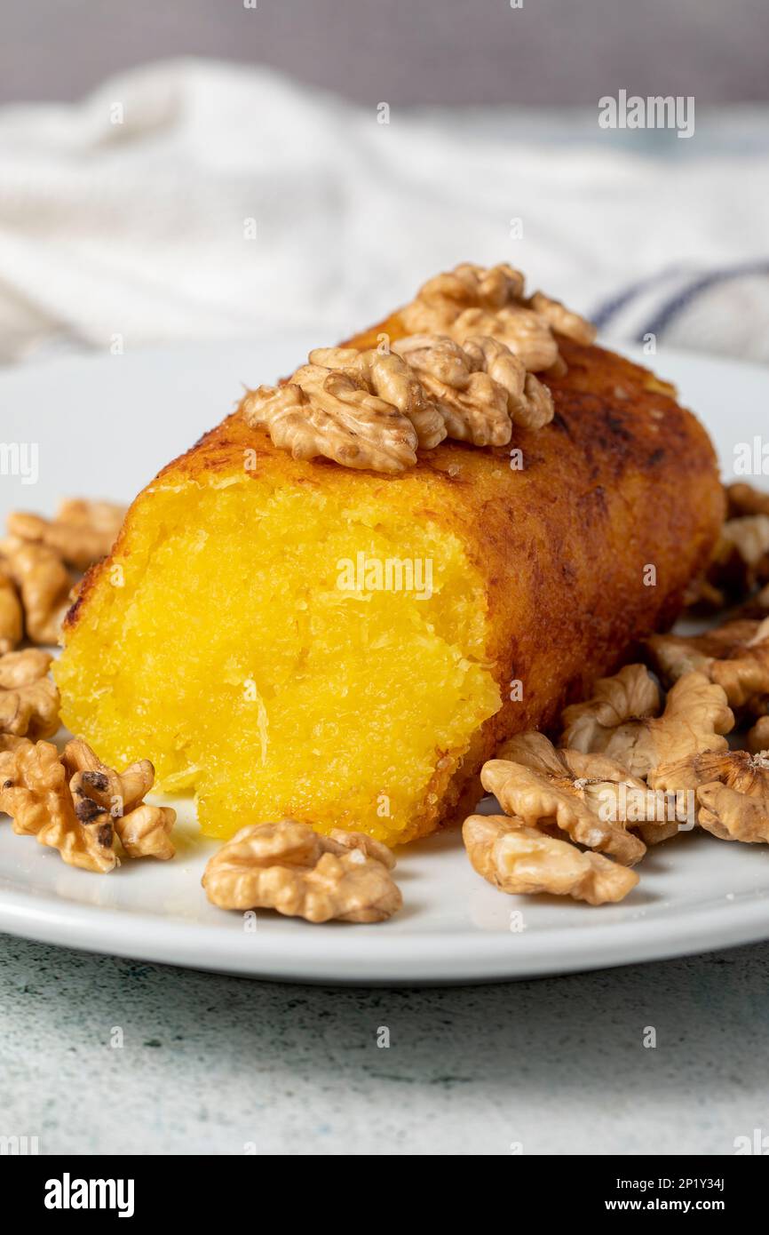 Cheese halva on gray floor. Traditional Mediterranean cuisine flavors ...