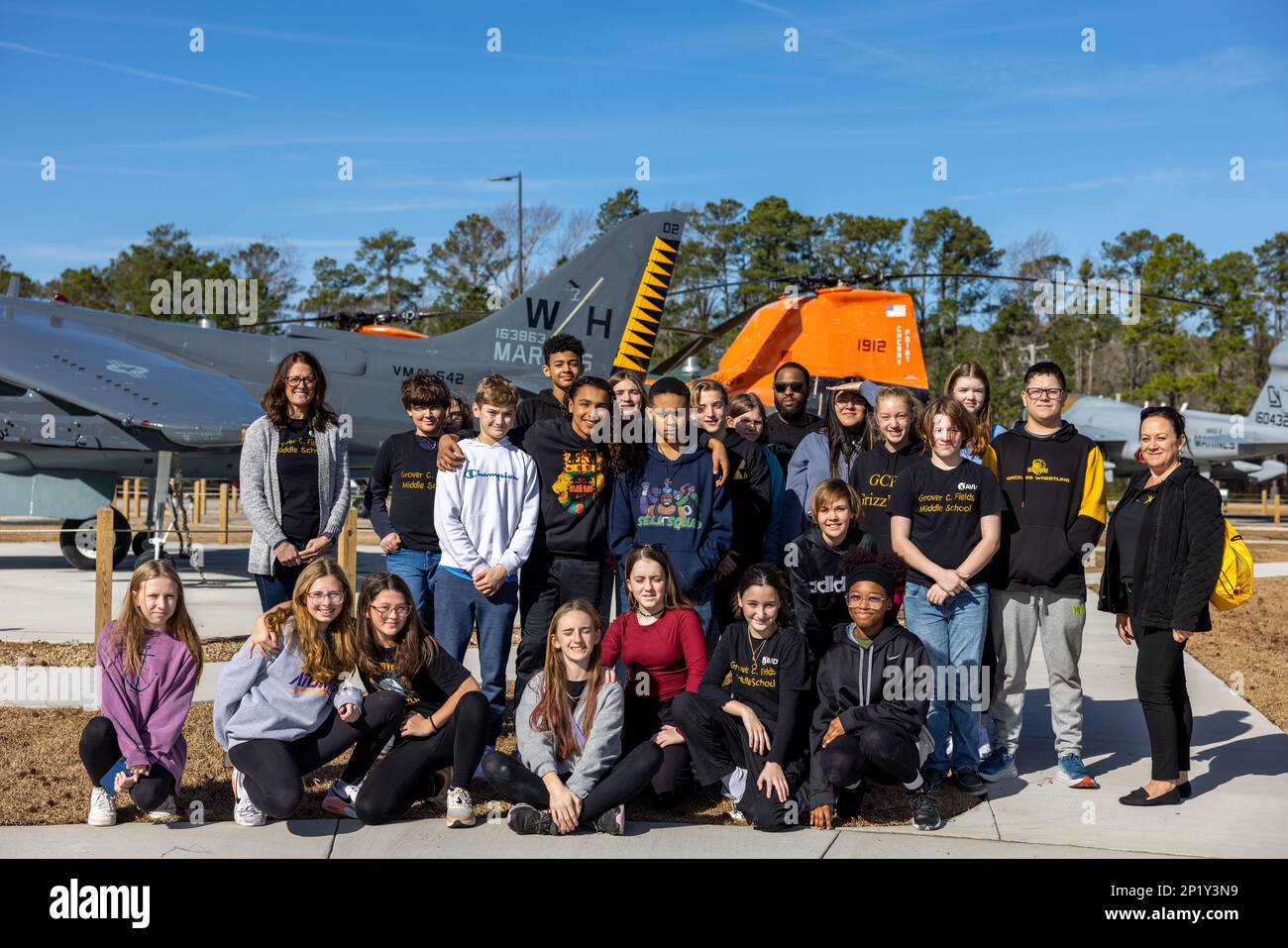 Students and teachers from Grover C. Fields Middle School take a group ...