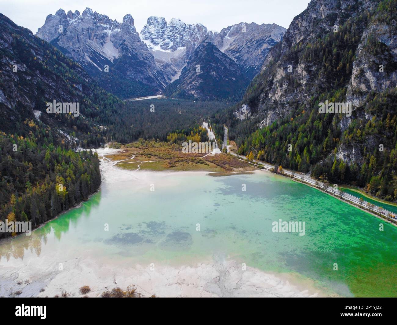 Aerial drone. Lake Landro and its valley overlooking the Lavaredo three ...
