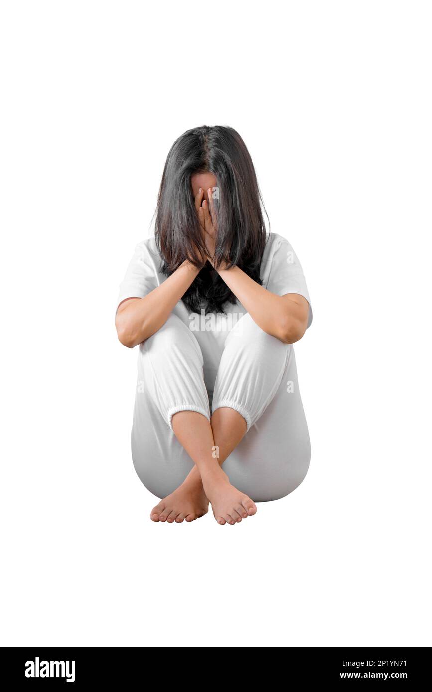 The depressed woman sitting isolated over white background Stock Photo ...