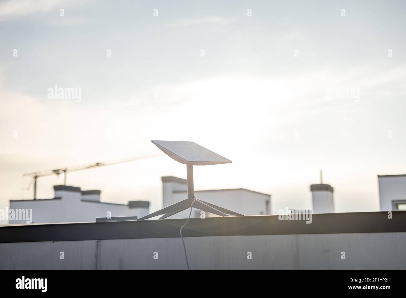 Starlink satellite dish on roof of residential building Stock Photo - Alamy