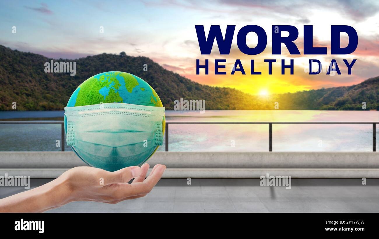 Human hand showing earth with a face mask. World Health Day Concept ...