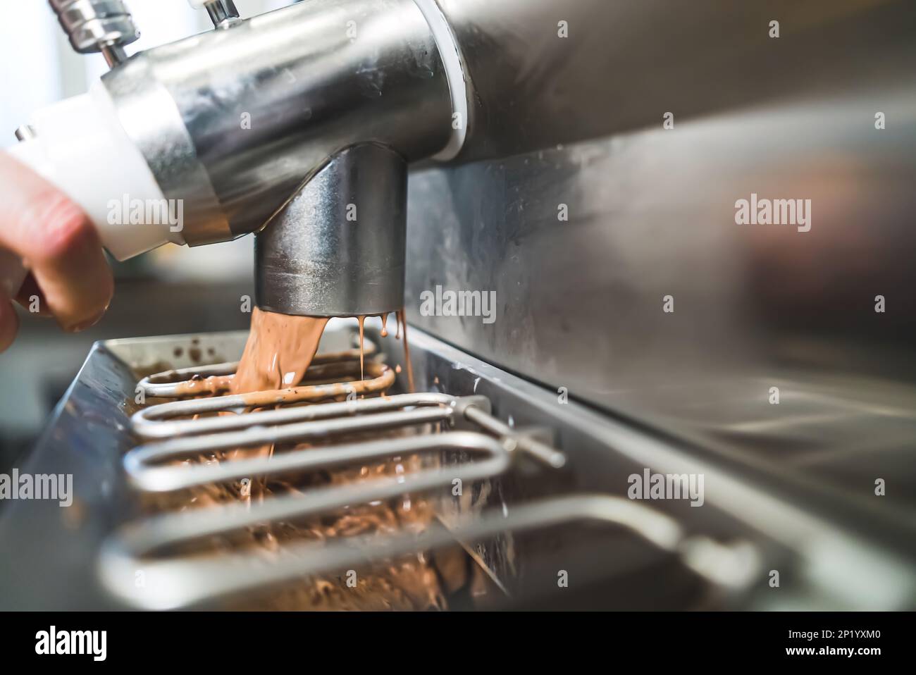 Tasty chocolate ice cream making with batch freezer machine ...