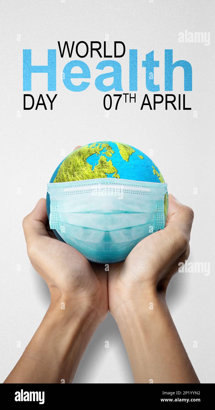Human hand showing earth with a face mask. World Health Day Concept ...