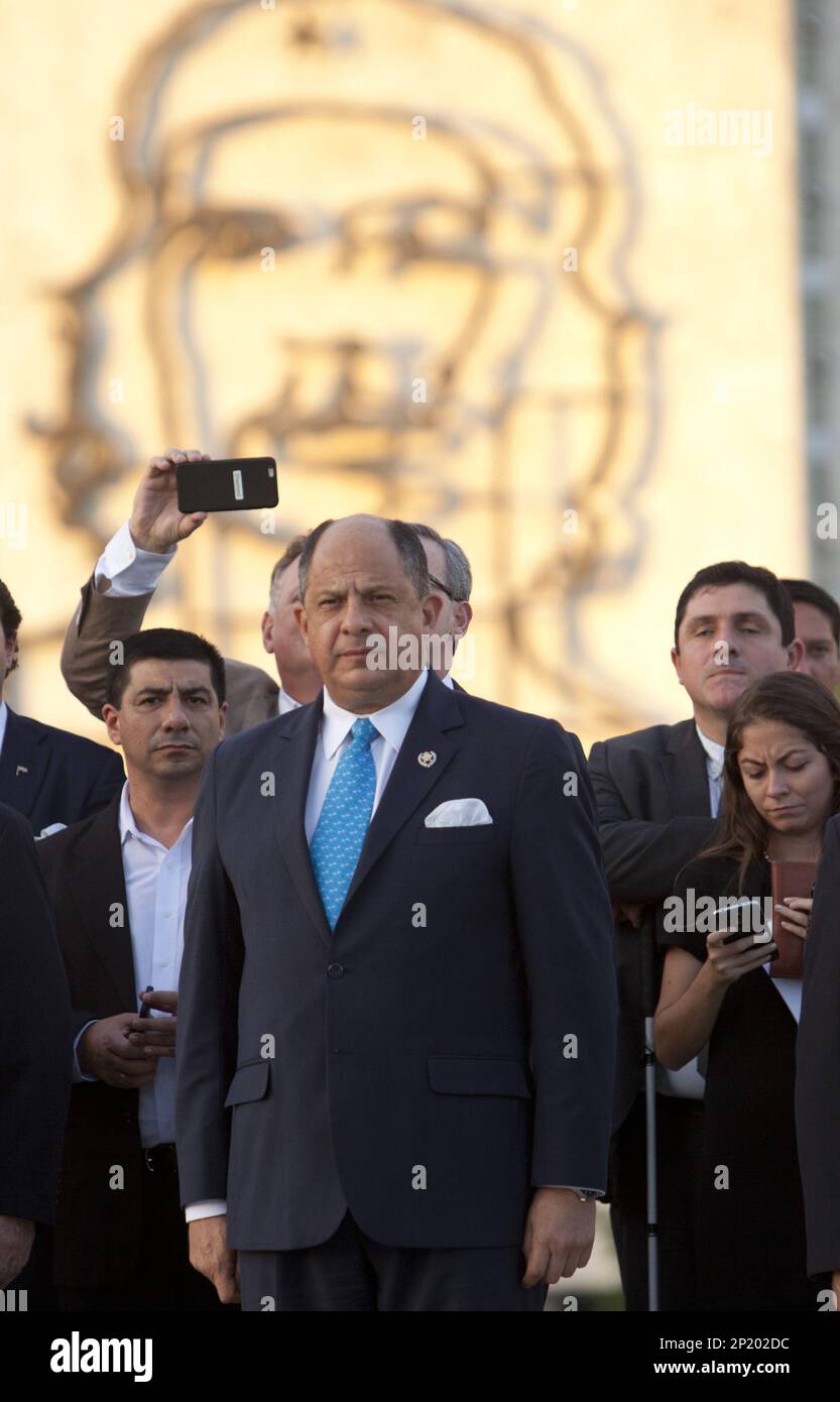 Costa Rica's President Luis Guillermo Solis Rivera, center, attends a ...