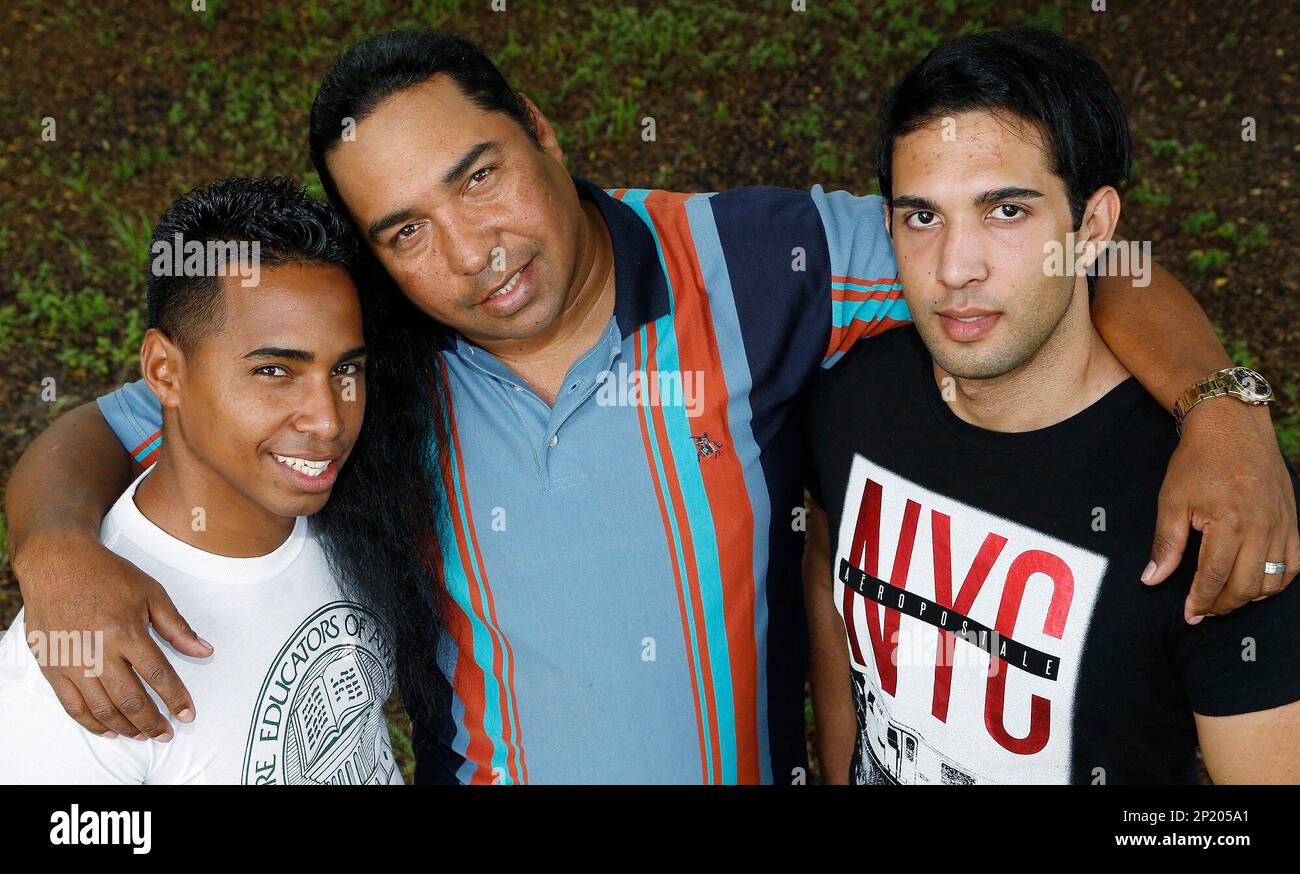 From left, Reinaldo Favier Vega, his father Reynaldo Favier Cobas and ...