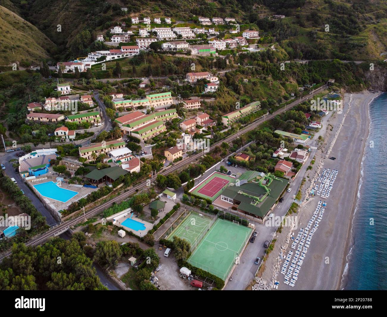 Aerial drone. Capo Calava bay and beach, with several holiday parks ...