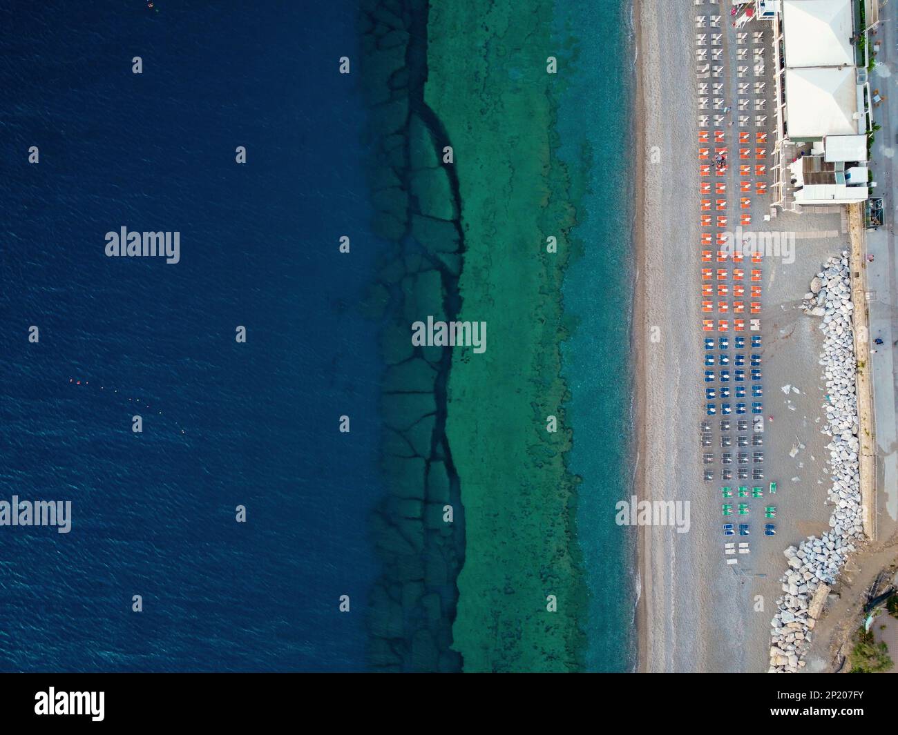 Aerial drone. Capo Calava bay and beach, with several holiday parks ...