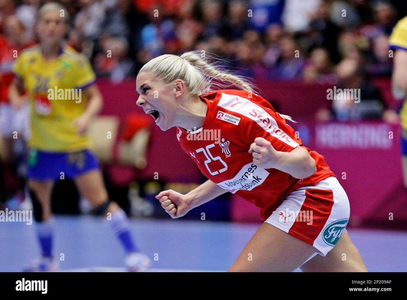 Denmark’s Trine Oestergaard celebrates a scoring against Sweden during ...