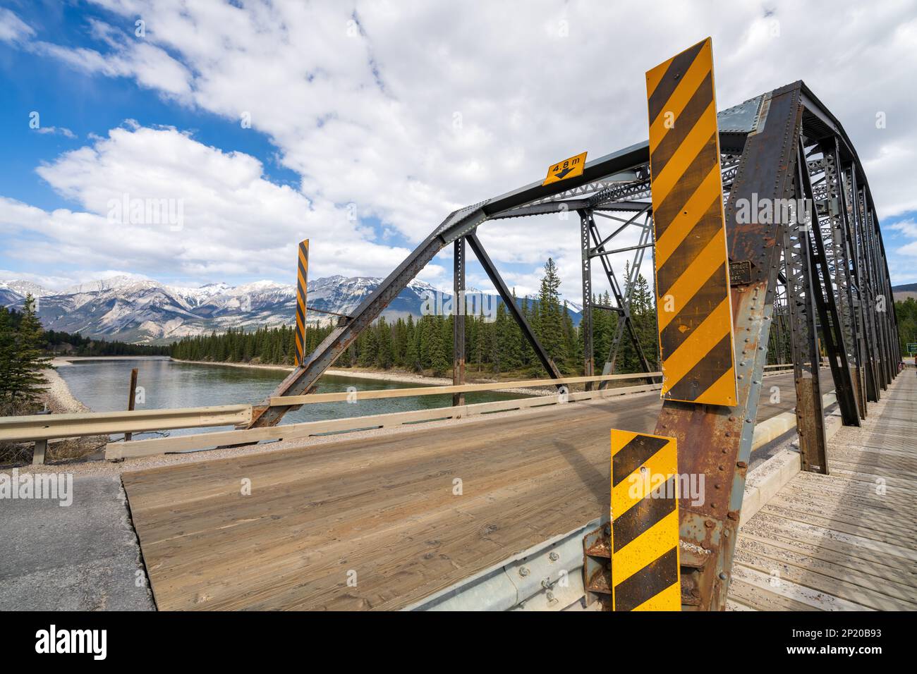 H. J. Moberly Bridge. Athabasca River under blue sky and white clouds ...