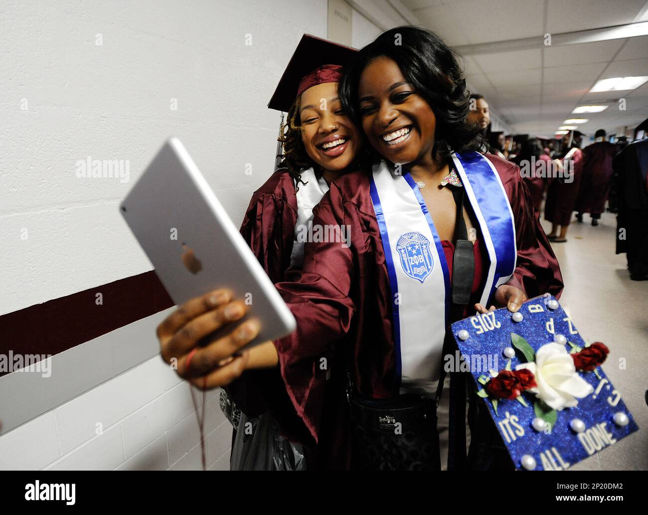 Carin Lawyer, 22, and Jerisha Wright, 23, take a photo of themselves on ...