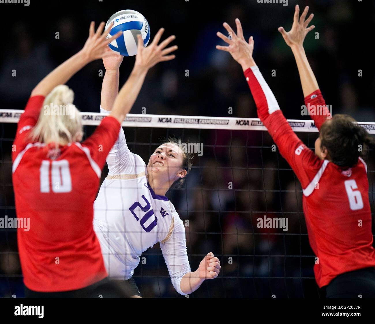 Washington outside hitter Tia Scambray (20) attempts a kill against ...