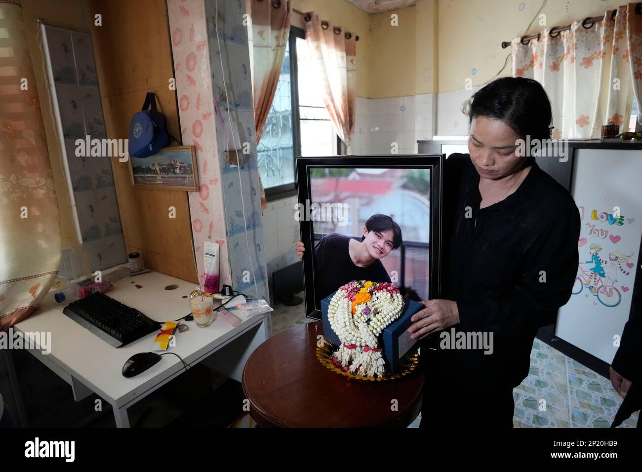 Family members of Duangphet Phromthep bring his ashes to the living ...