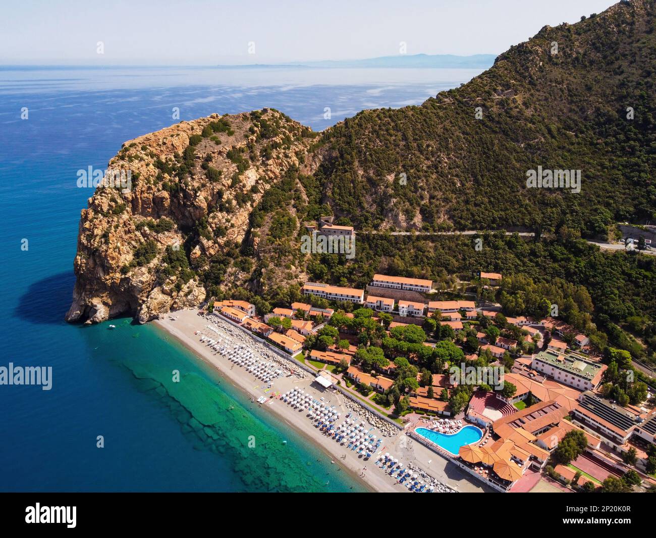 Aerial drone. Capo Calava bay and beach, with several holiday parks ...