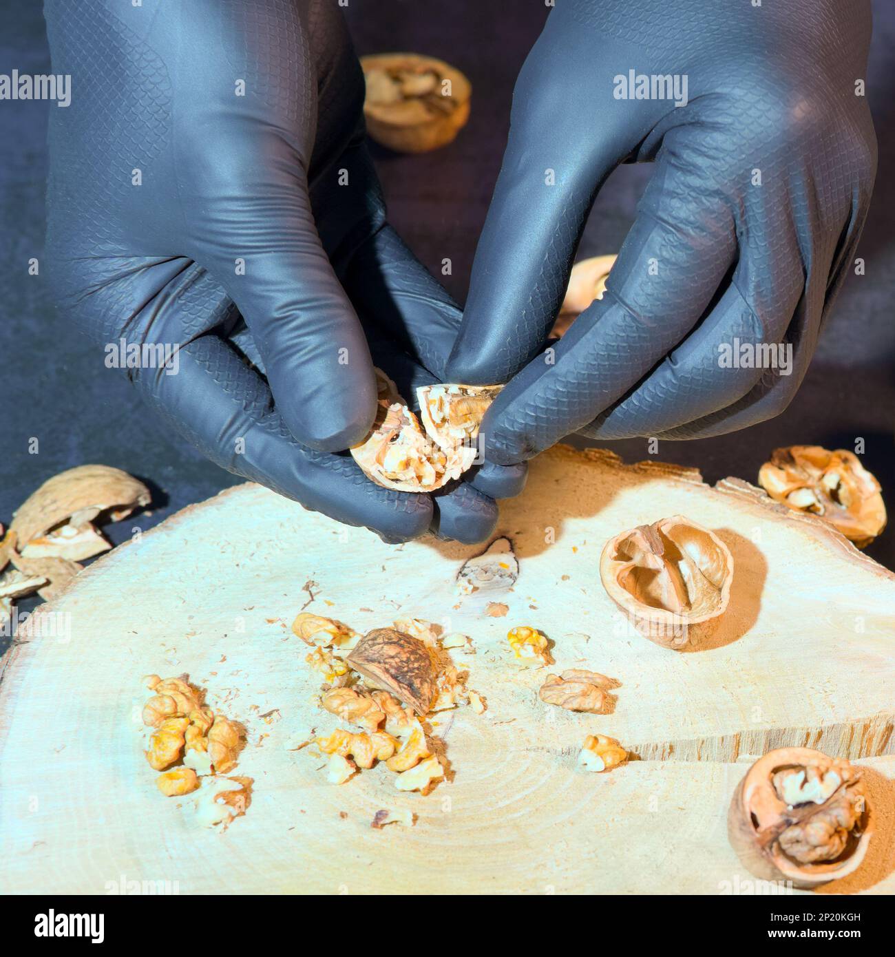 the chef crushes walnuts with his gloved hands Stock Photo - Alamy