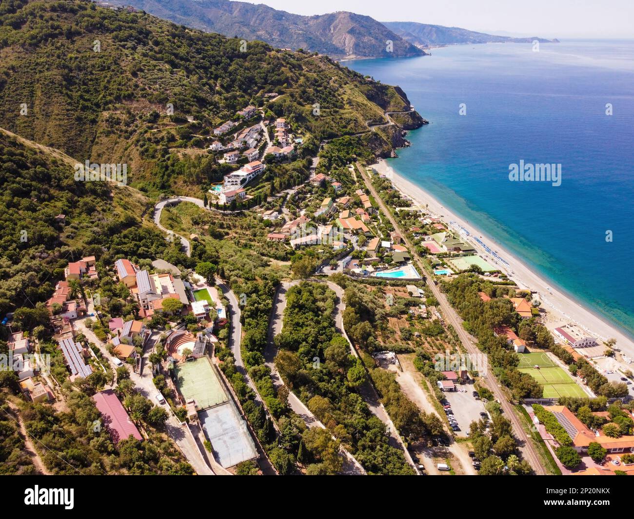 Aerial drone. Capo Calava bay and beach, with several holiday parks ...