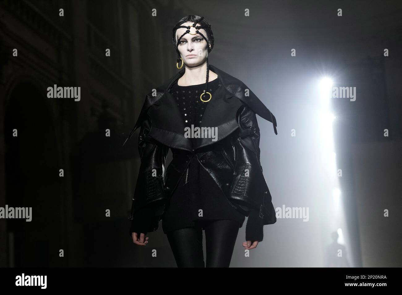 A model wears a creation as part of the Junya Watanabe Fall/Winter 2023 ...