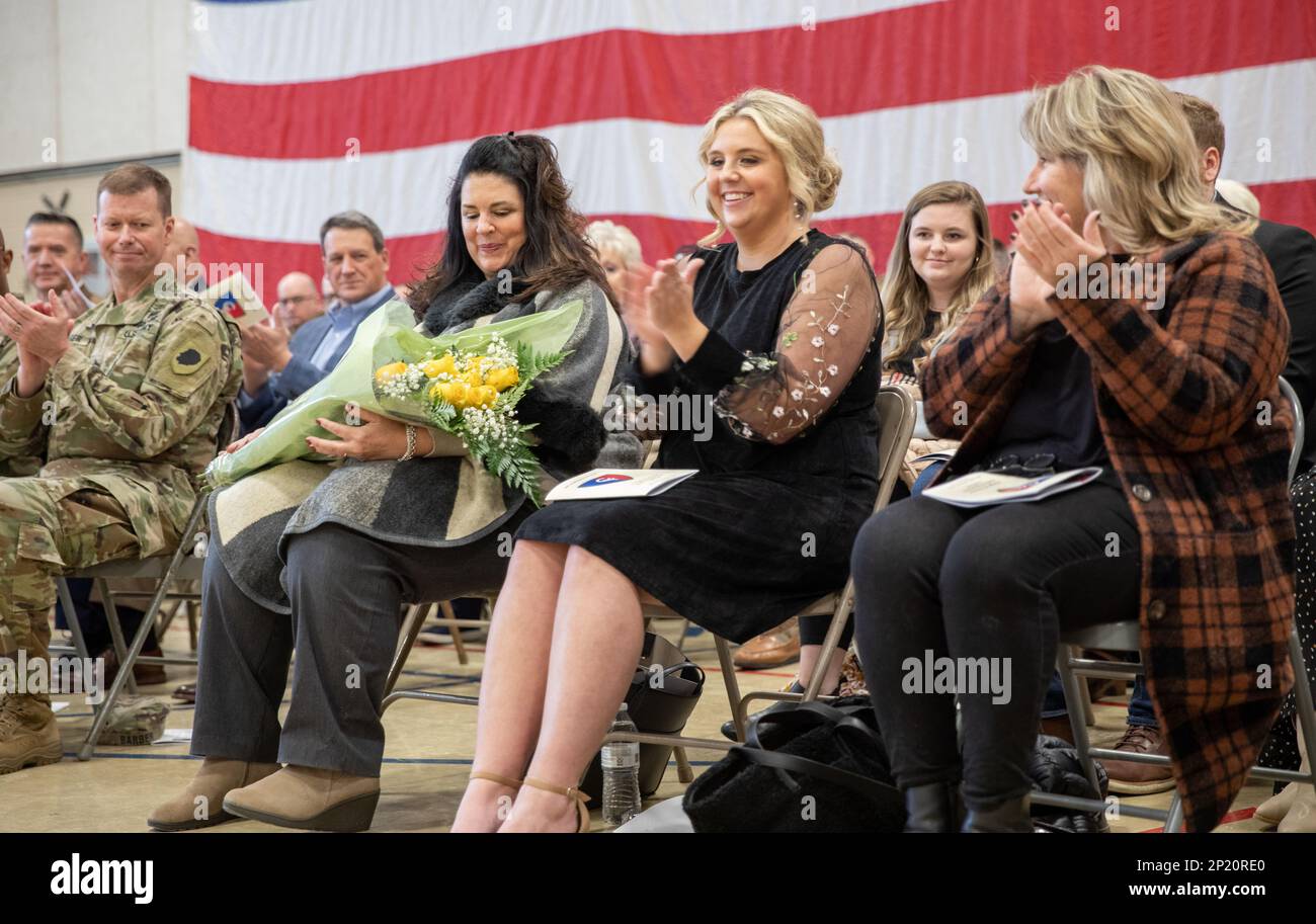 Lisa Degelow, wife of Brig. Gen. Dan Degelow, looks at flowers ...