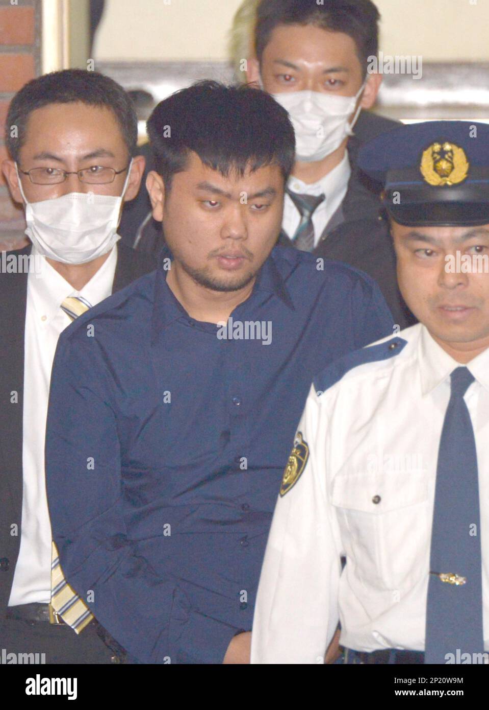 Chon Chang Han (C) is transferred from the Kojimachi Police Station to ...