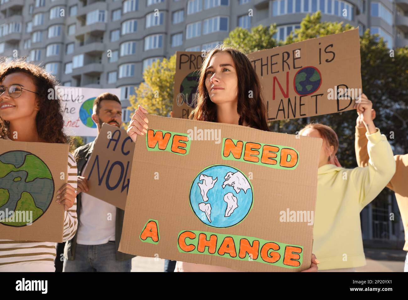 Group of people with posters protesting against climate change on city ...