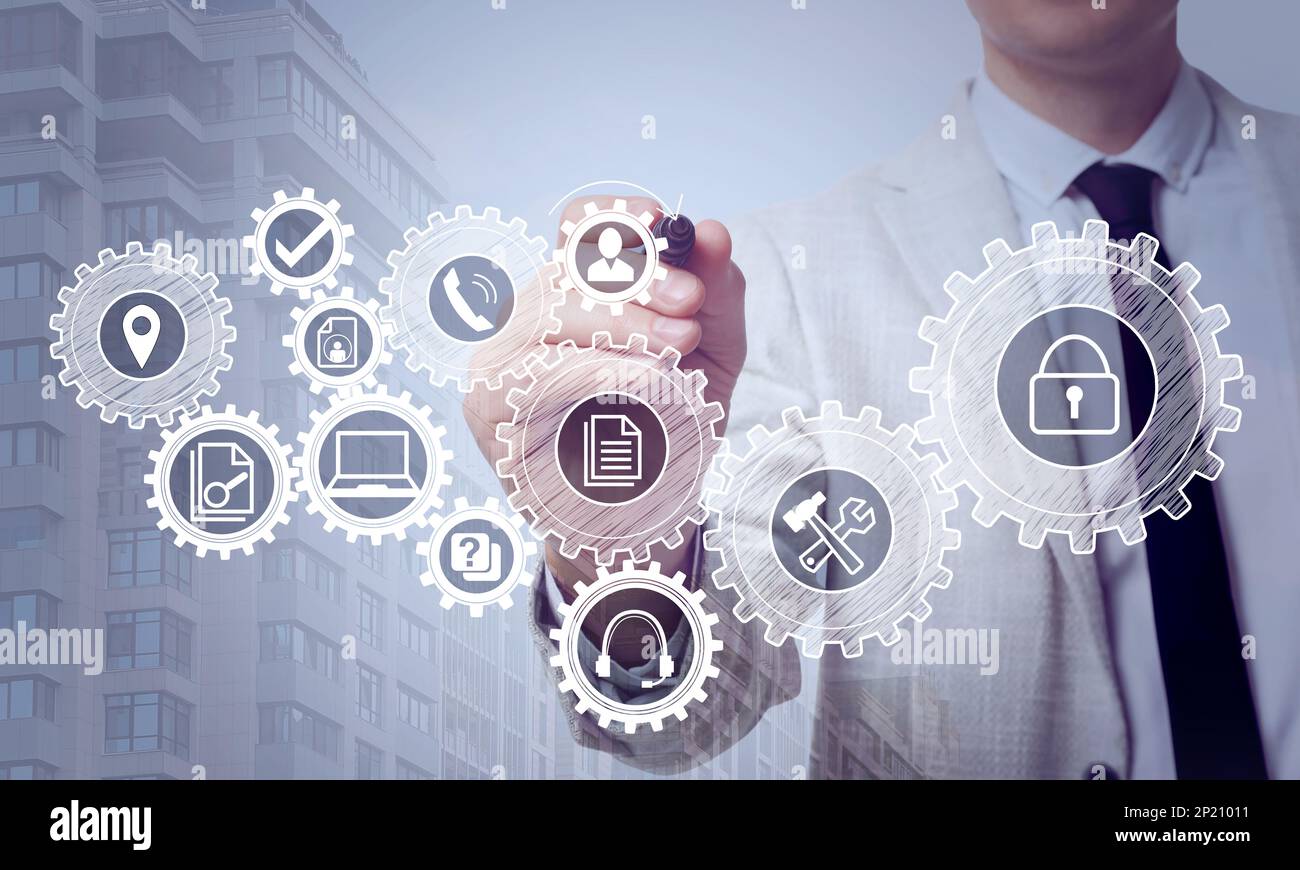 Business process. Man touching virtual screen with different icons ...