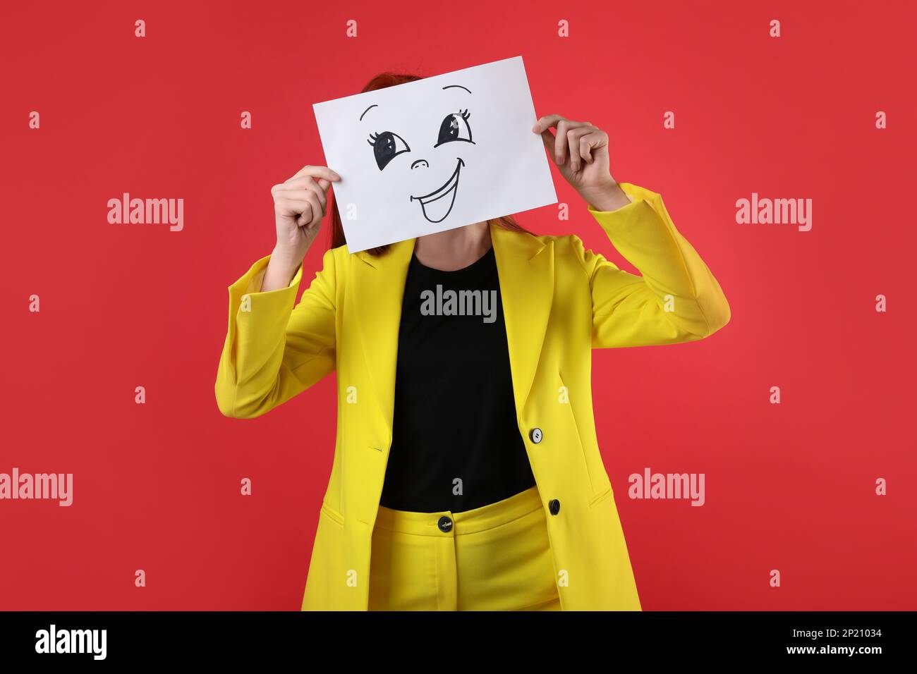 Girl hiding face behind paper hi-res stock photography and images - Alamy