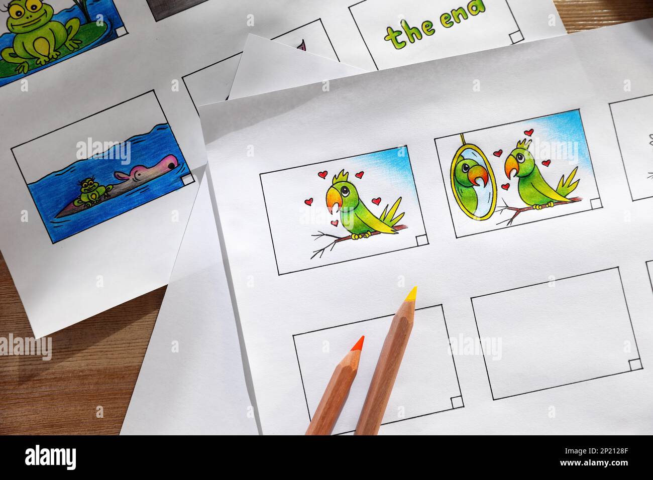 Storyboards with cartoon sketches at workplace, flat lay. Pre ...