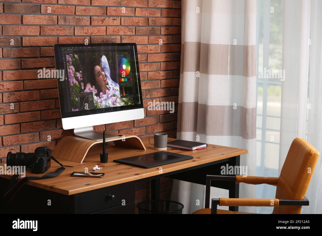 Modern retoucher's workplace with different digital devices on wooden ...