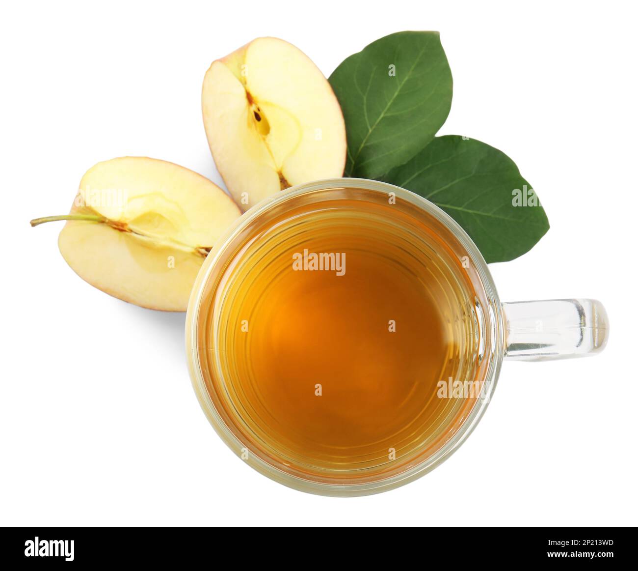 Glass mug with delicious cider, pieces of ripe apple and leaves on ...