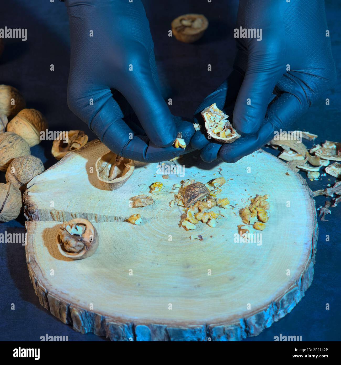 the chef crushes walnuts with his gloved hands Stock Photo - Alamy