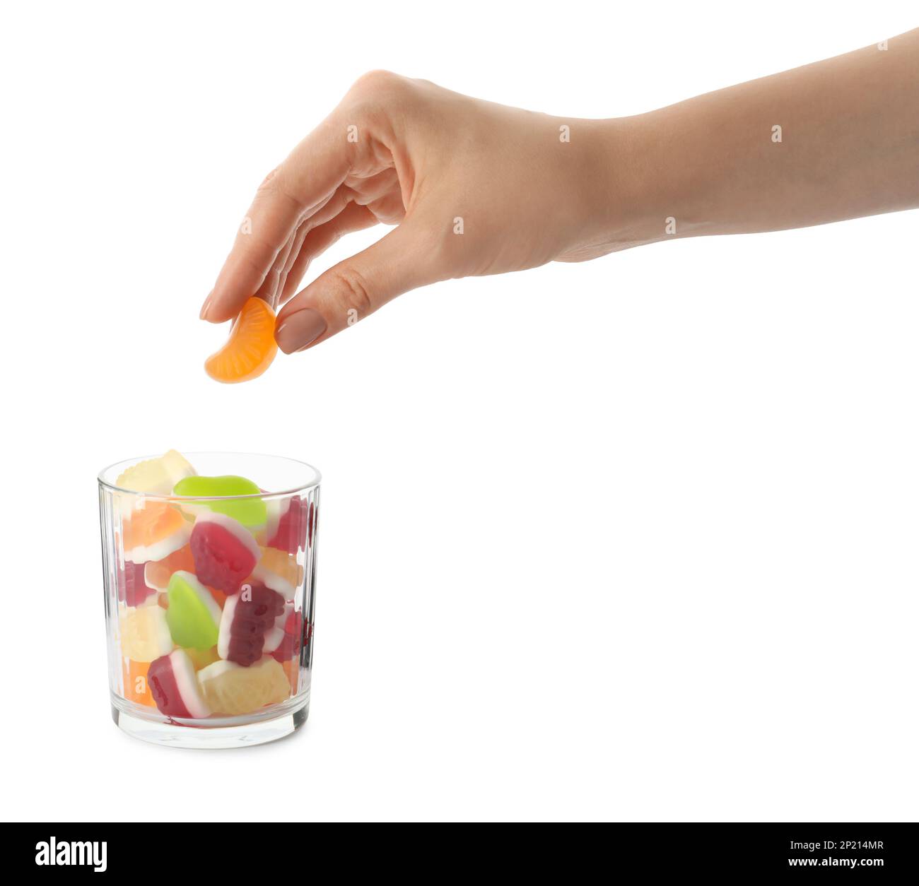 Woman taking gummy candy from glass on white background, closeup Stock ...