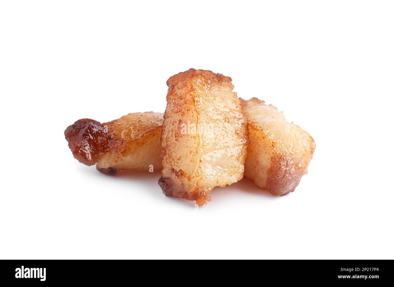 Tasty fried cracklings on white background. Cooked pork lard Stock ...