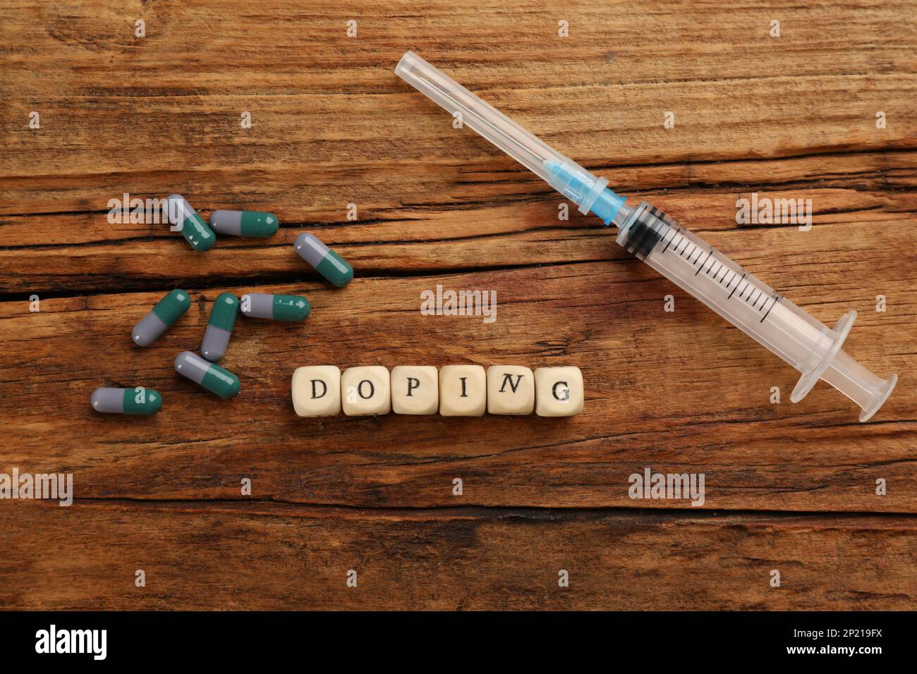 Cubes with word Doping and drugs on wooden background, flat lay Stock ...