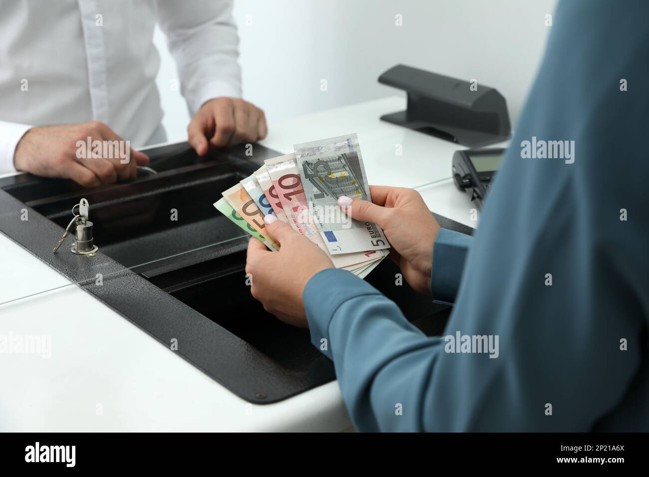 Bank teller window hi-res stock photography and images - Alamy