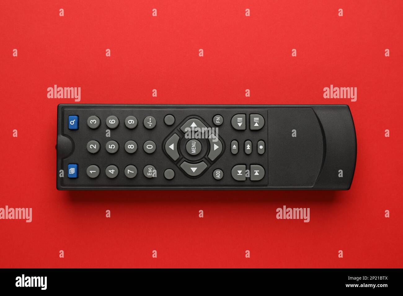 Remote control on red background, top view Stock Photo - Alamy