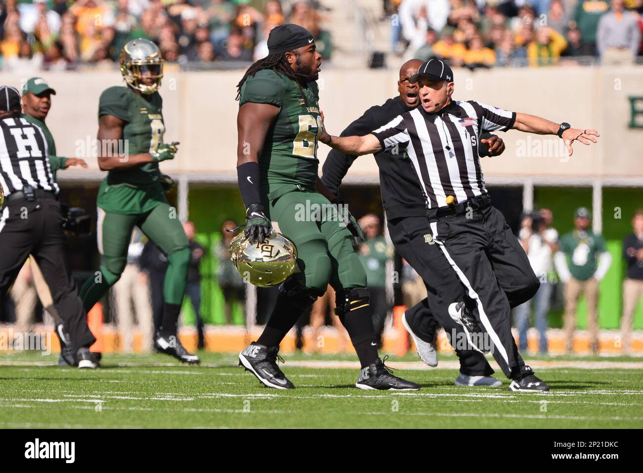 Game official Craig Faulkner prevent offensive lineman Ishmael Wilson ...