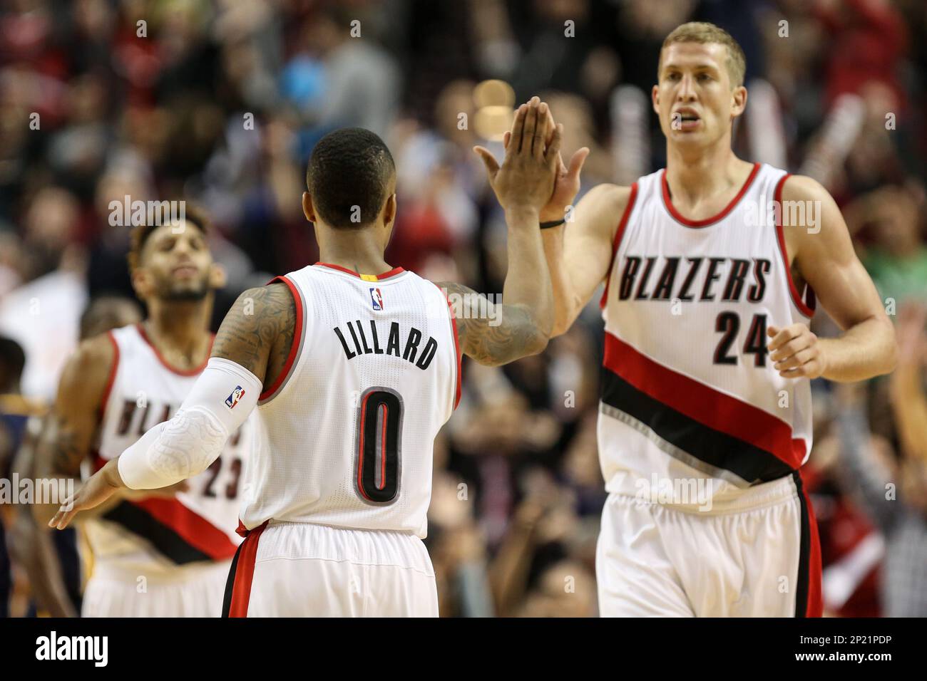 Dec. 3, 2015 - DAMIAN LILLARD (0), left, congratulates MASON PLUMLEE ...