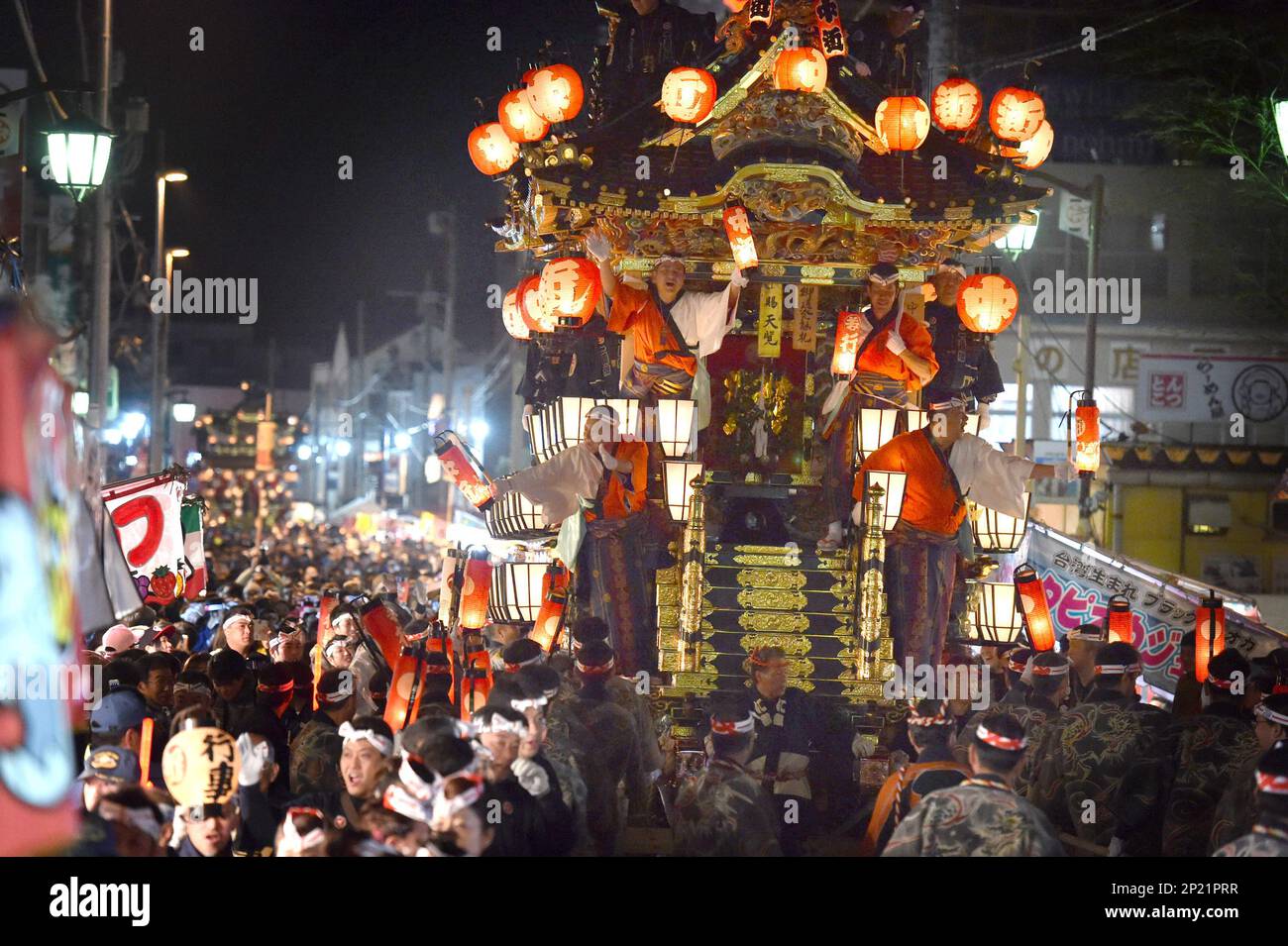 People carry a mikoshi and floats during the Chichibu Niight Festival ...