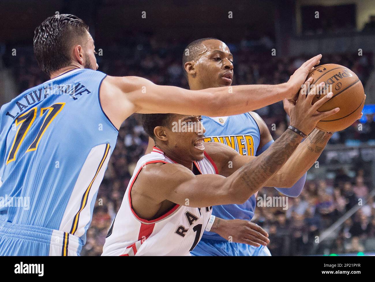 Toronto Raptors guard DeMar DeRozan (10) drives to the net past Denver ...