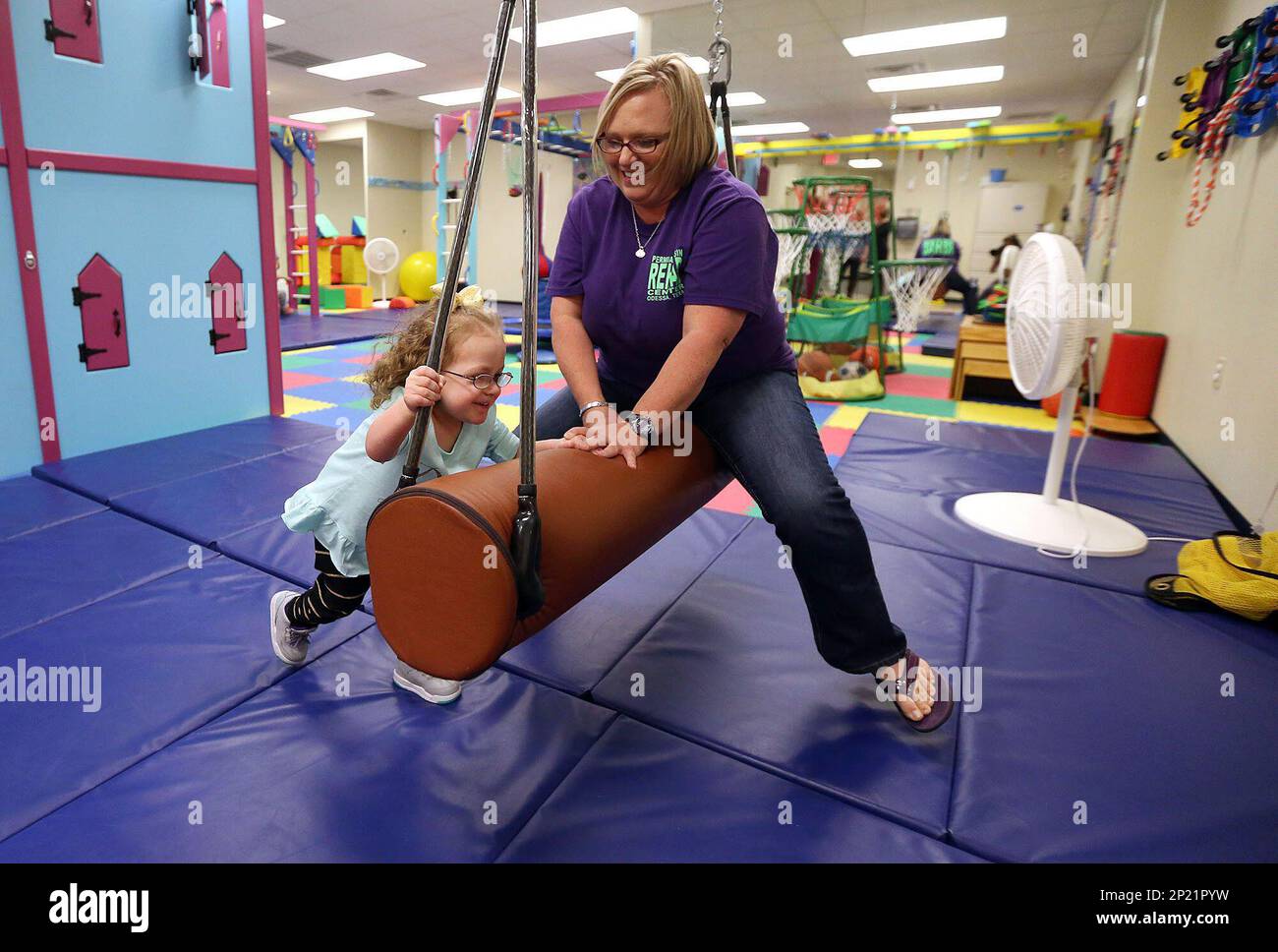 Physical therapist assistant Amy Burks has four-year-old Aubree Dodd ...