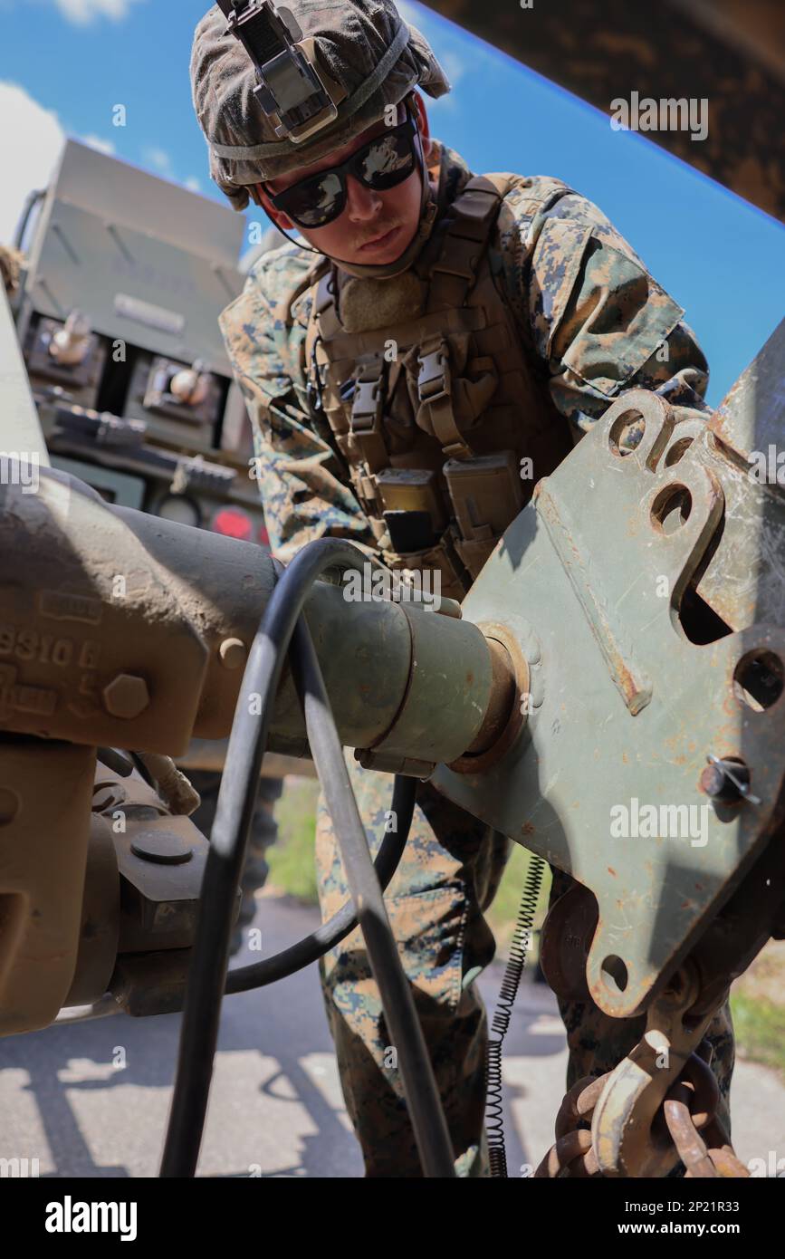 U.S. Marine Corps Cpl. Zachary Raatz, a vehicle recovery operator with ...