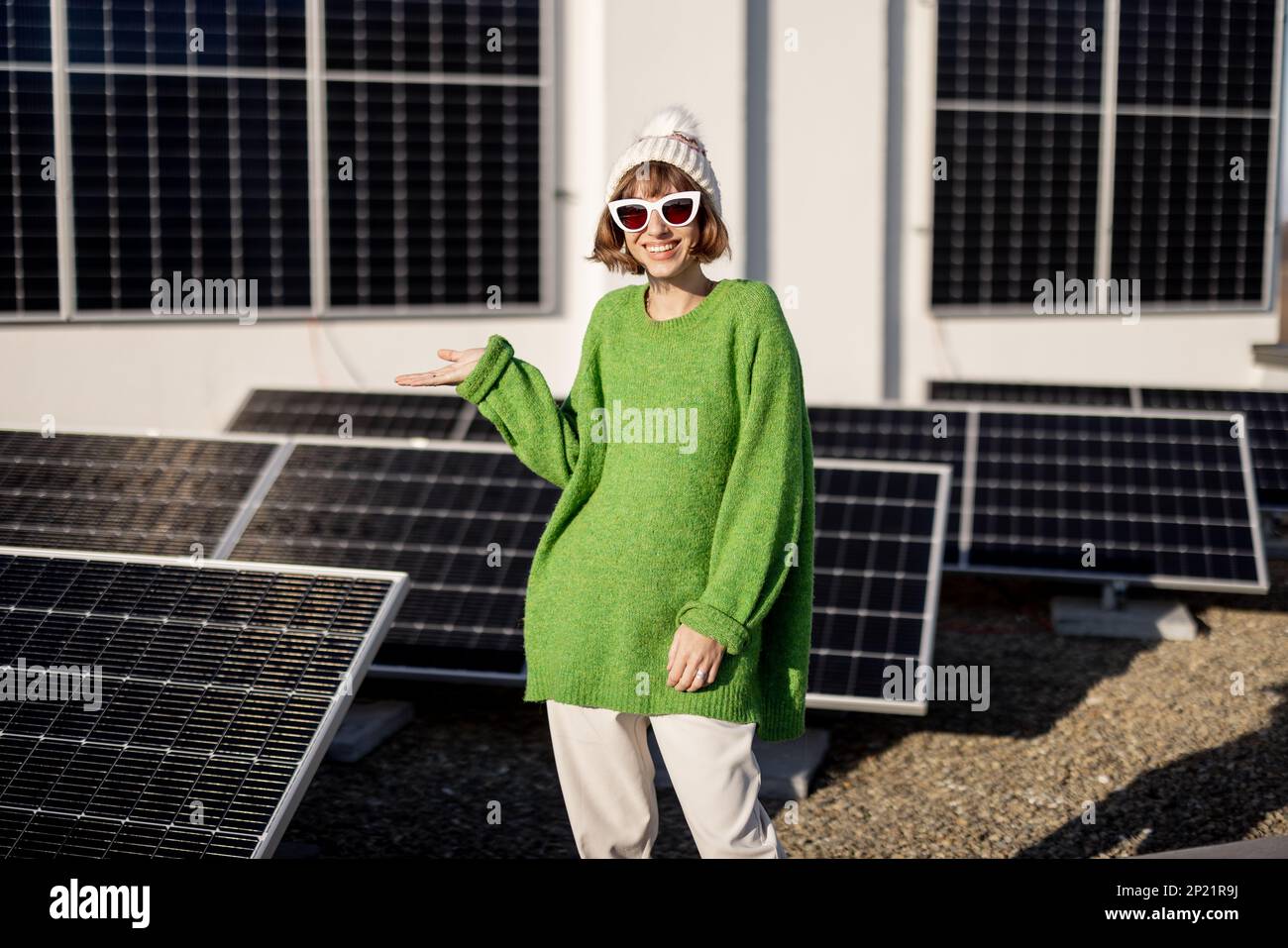 Happy house owner with a solar plant Stock Photo - Alamy