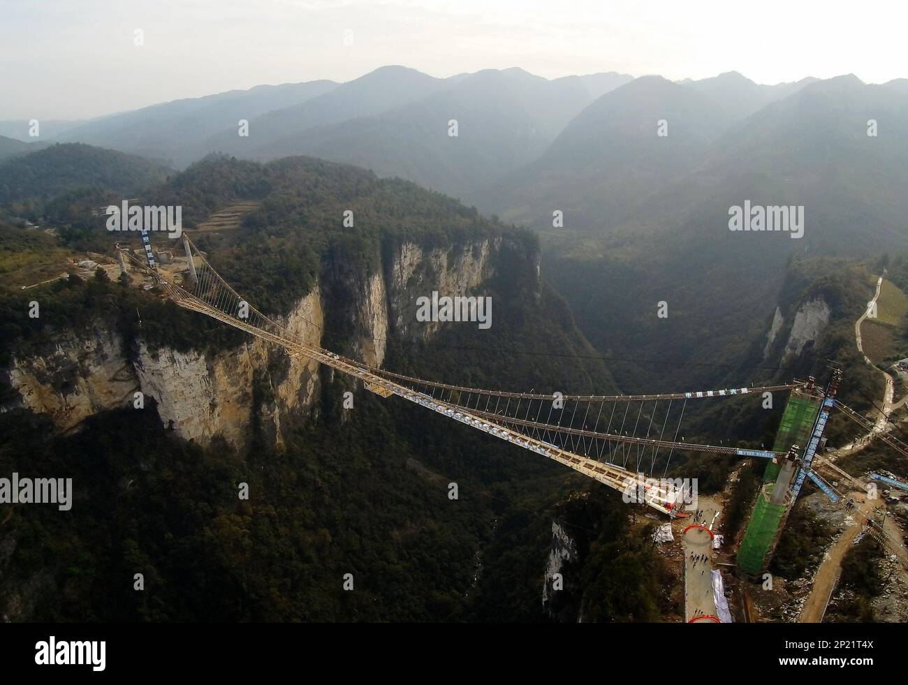 A partially-completed 430-meter (1,410-foot) bridge stretches about 300 ...